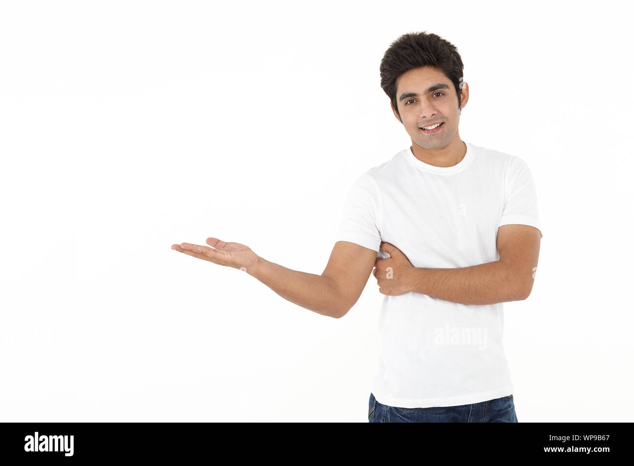 Smiling man displaying palm Cut Out Stock Images & Pictures - Alamy