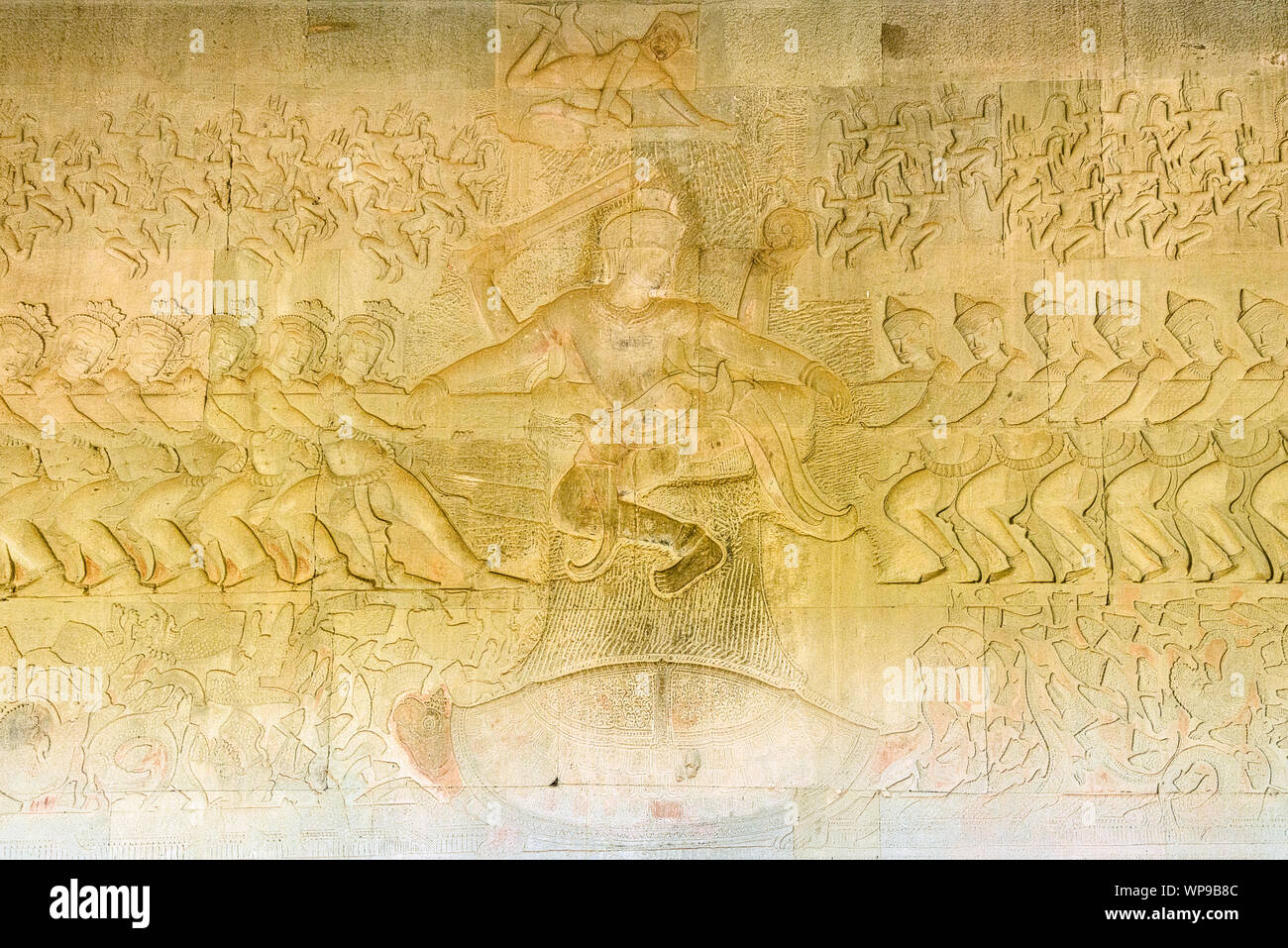 The bas-relief of the Churning of the Sea of Milk shows Vishnu in the ...
