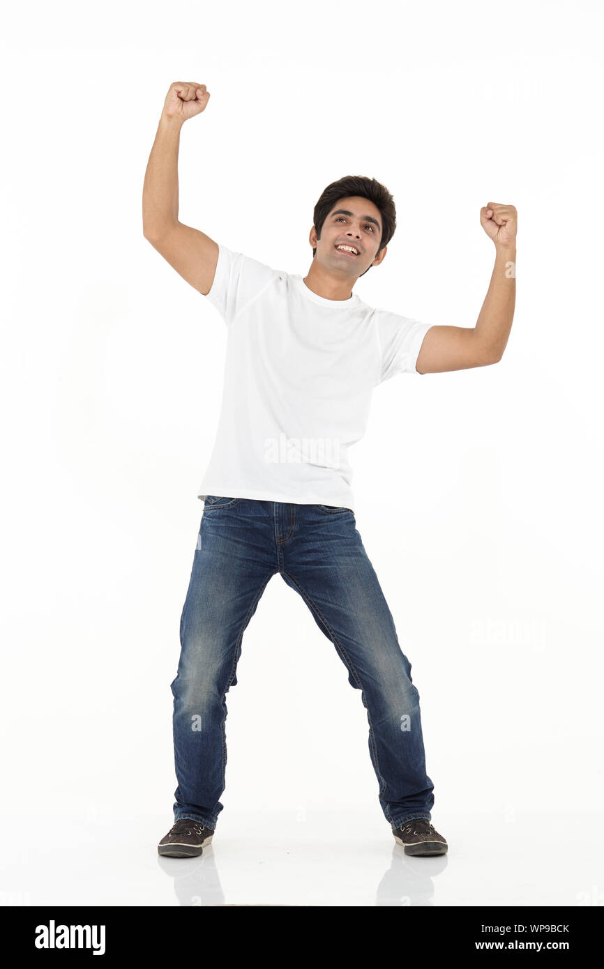 Young man celebrating his success Stock Photo - Alamy