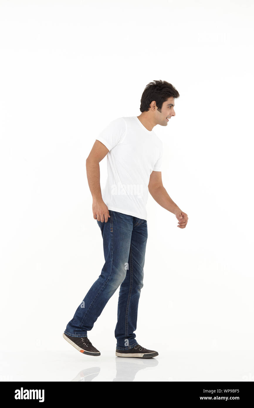 Indian man walking side view hi-res stock photography and images - Alamy