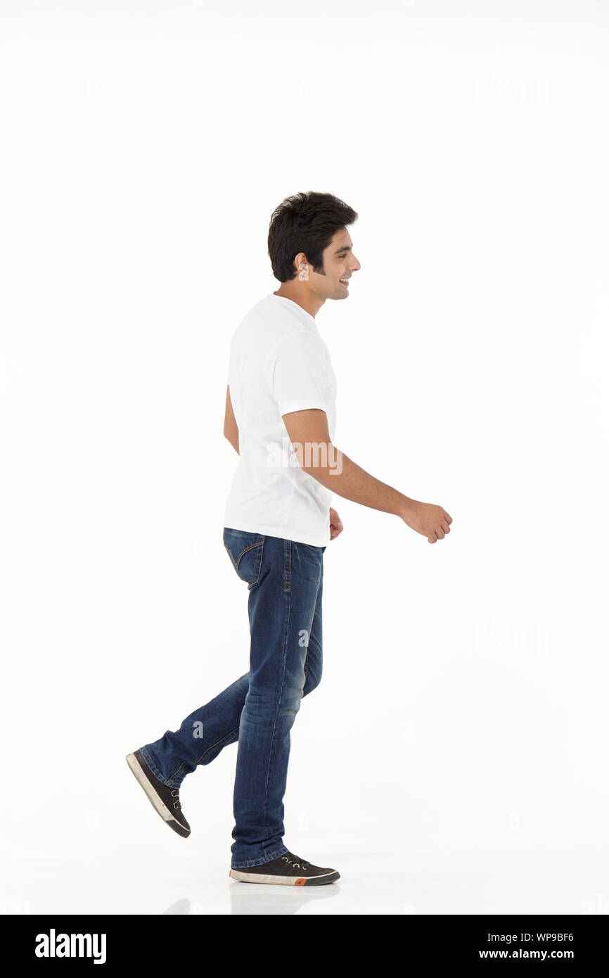Indian man walking side view hi-res stock photography and images - Alamy