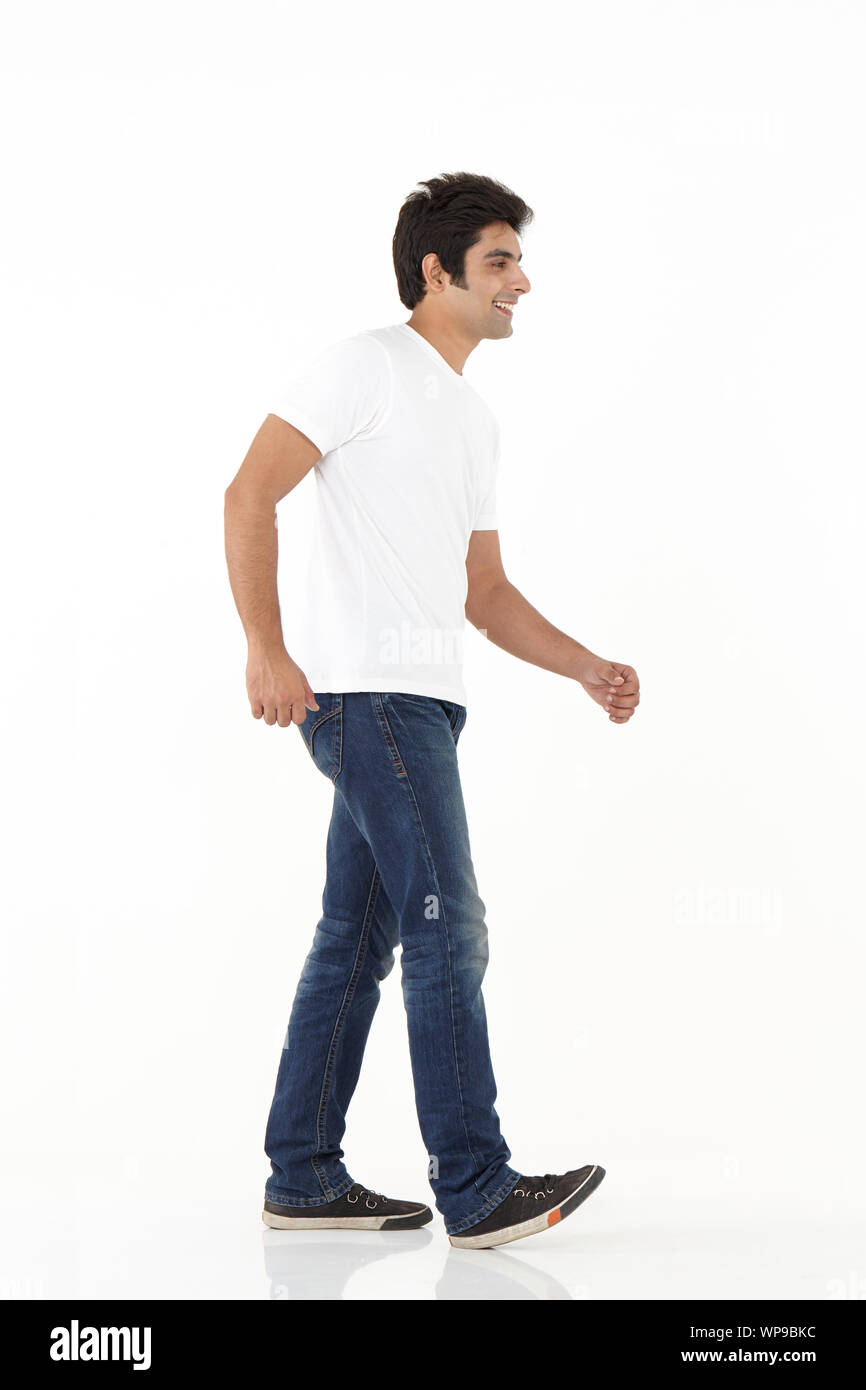 Indian man walking side view hi-res stock photography and images - Alamy