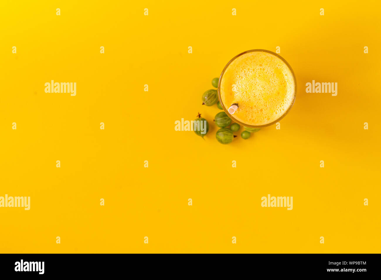 top view of a summer cool smoothie drink on a color surface with a copy ...