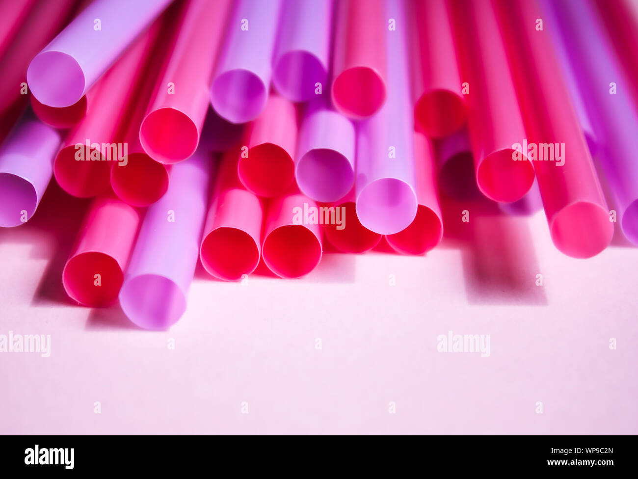 Electric lilac and pink plastic straws Stock Photo - Alamy