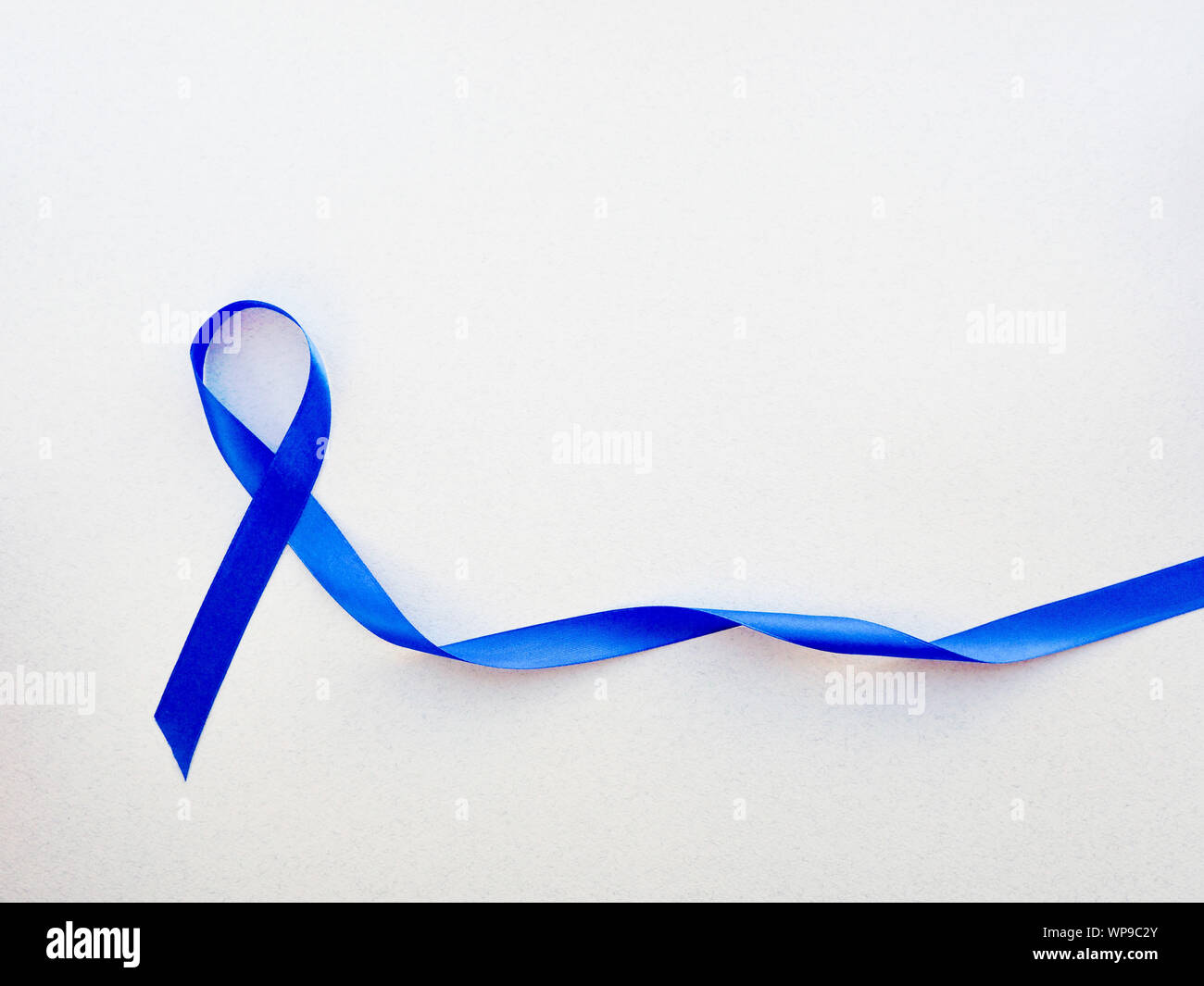 Blue awareness ribbon with trail on white background, Dark blue ribbon ...