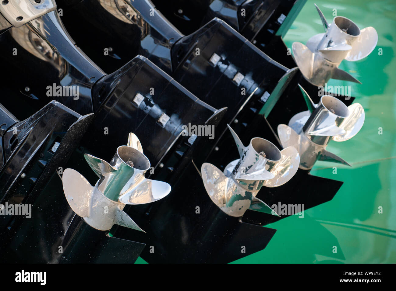 Four outboard motors on a speedboat Stock Photo - Alamy