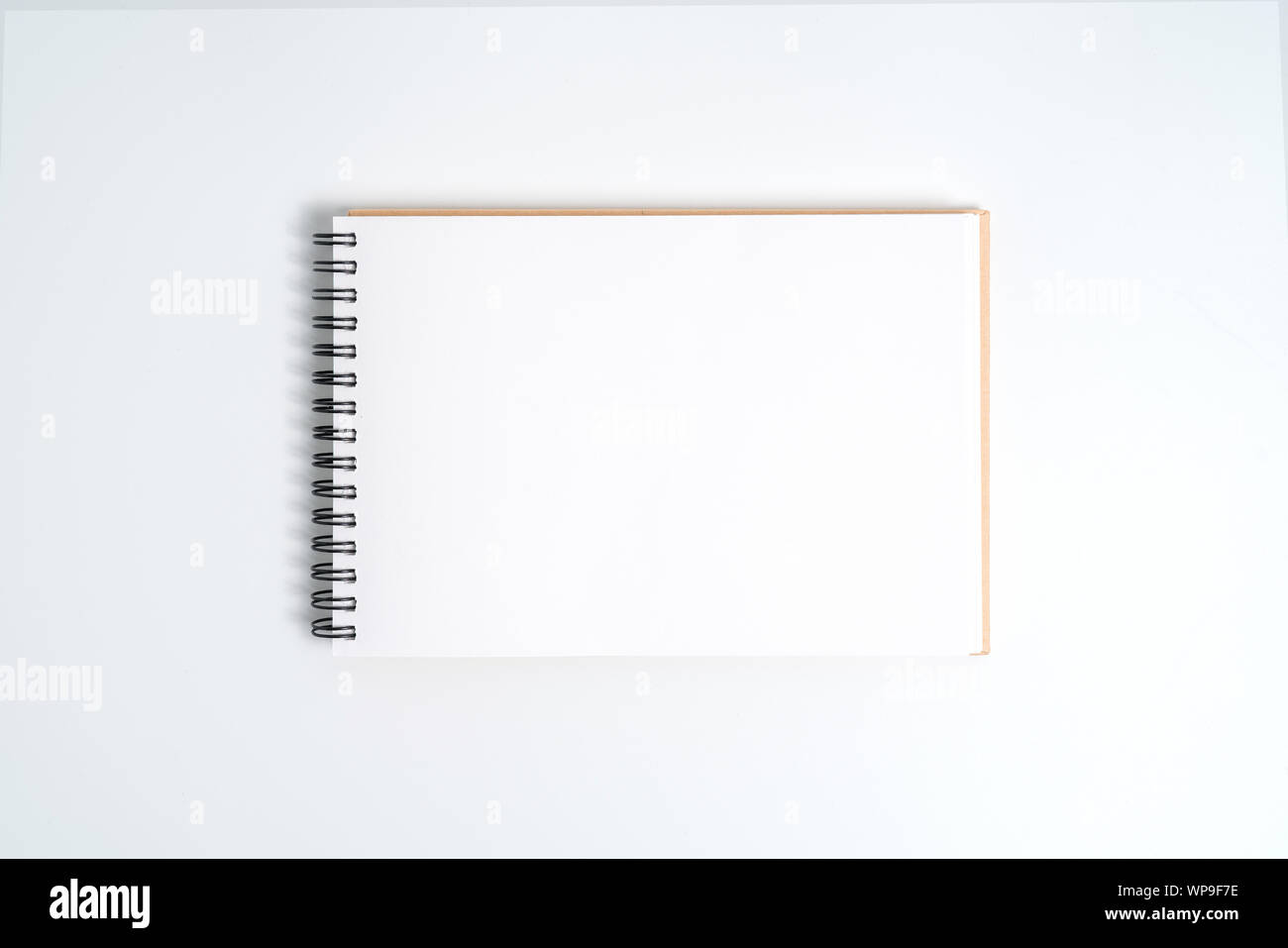 A notebook on a spring. Isolated on white background Stock Photo - Alamy