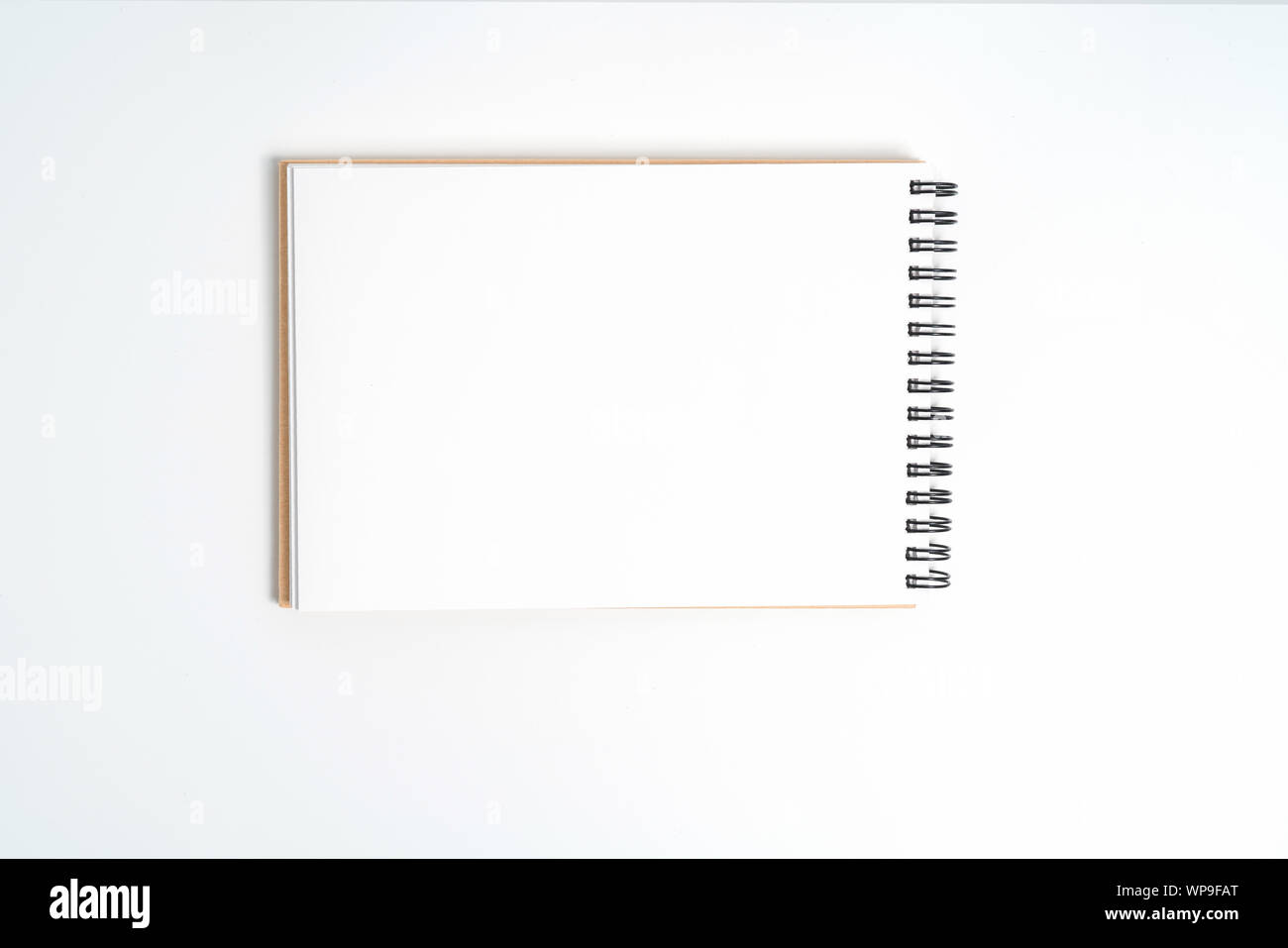 A notebook on a spring. Isolated on white background Stock Photo - Alamy