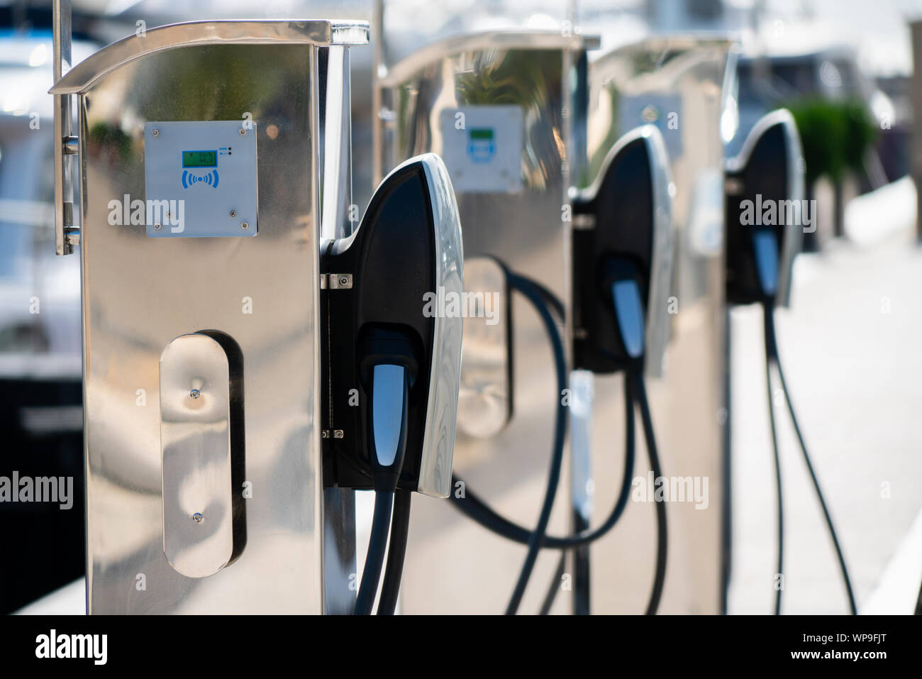 Electric car charging station in luxury marina by the sea Stock Photo ...