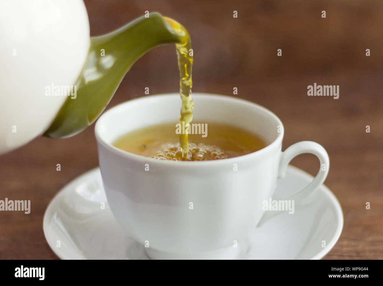 Tea poured cup on background hi-res stock photography and images - Alamy