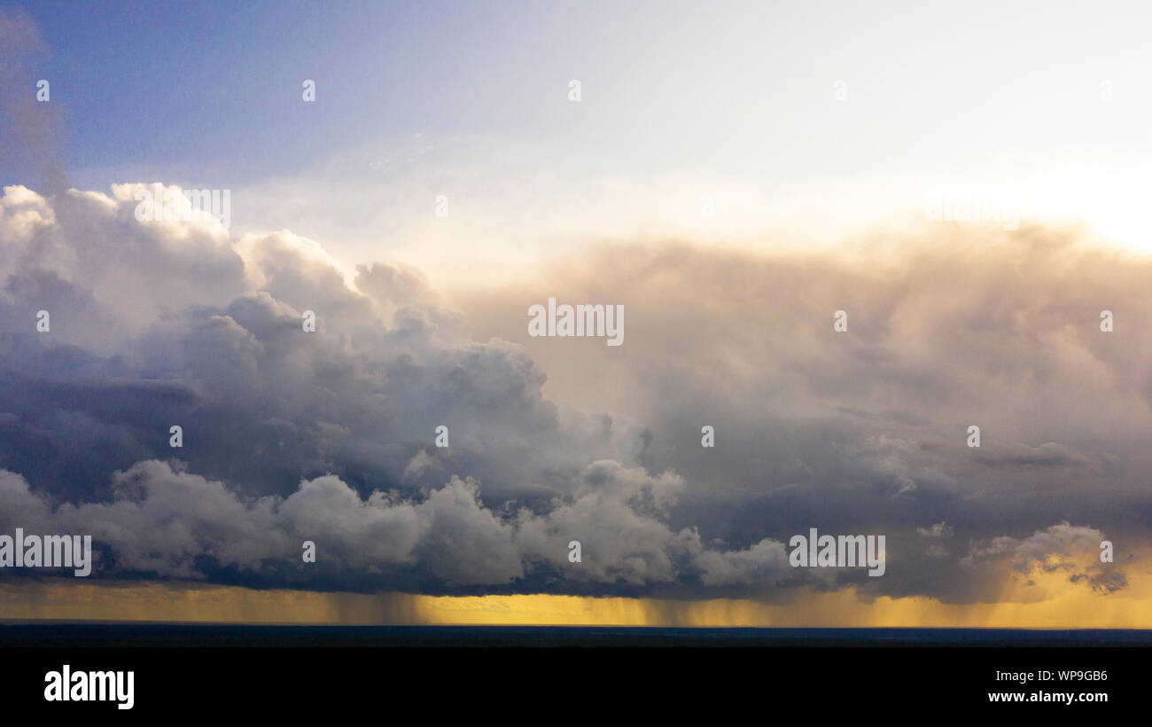 Aerial image of dark Storm clouds over the land. Aerial panorama of ...