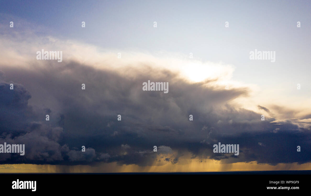 Aerial image of dark Storm clouds over the land. Aerial panorama of ...