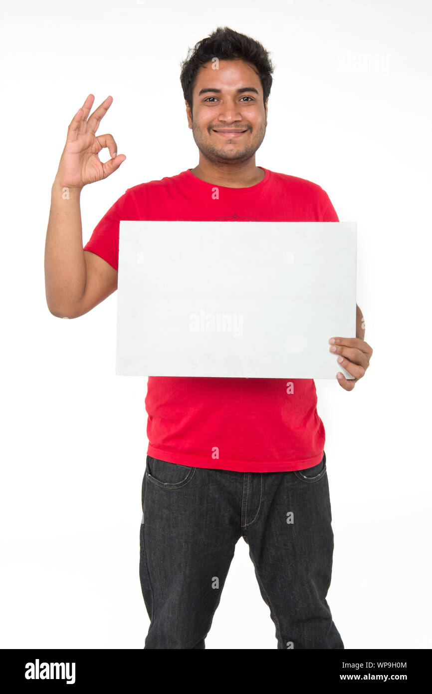Young man showing a placard with OK sign Stock Photo - Alamy