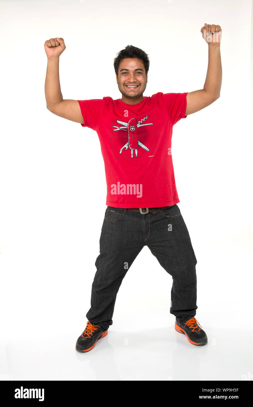 Young man celebrating his success Stock Photo - Alamy