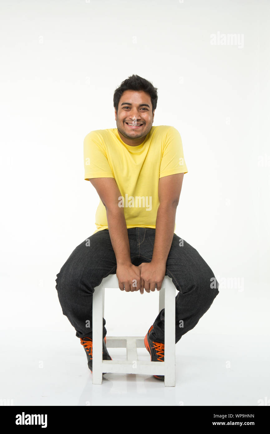 Man sitting on stool hi-res stock photography and images - Alamy
