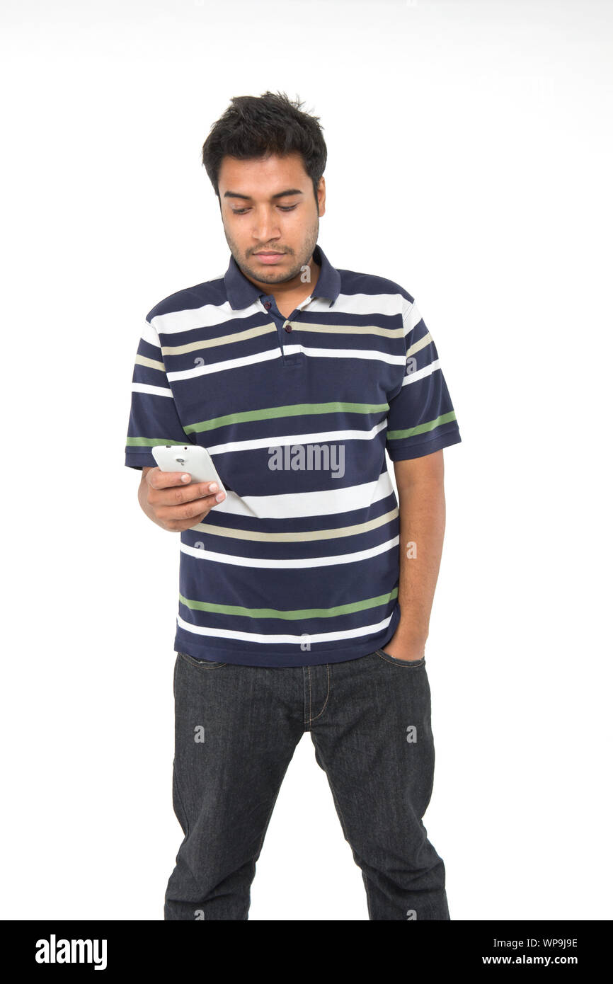 Young man reading message Stock Photo - Alamy