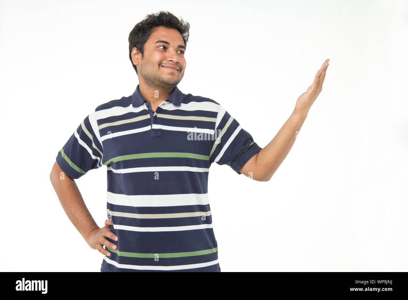 Young man showing empty palm Stock Photo - Alamy