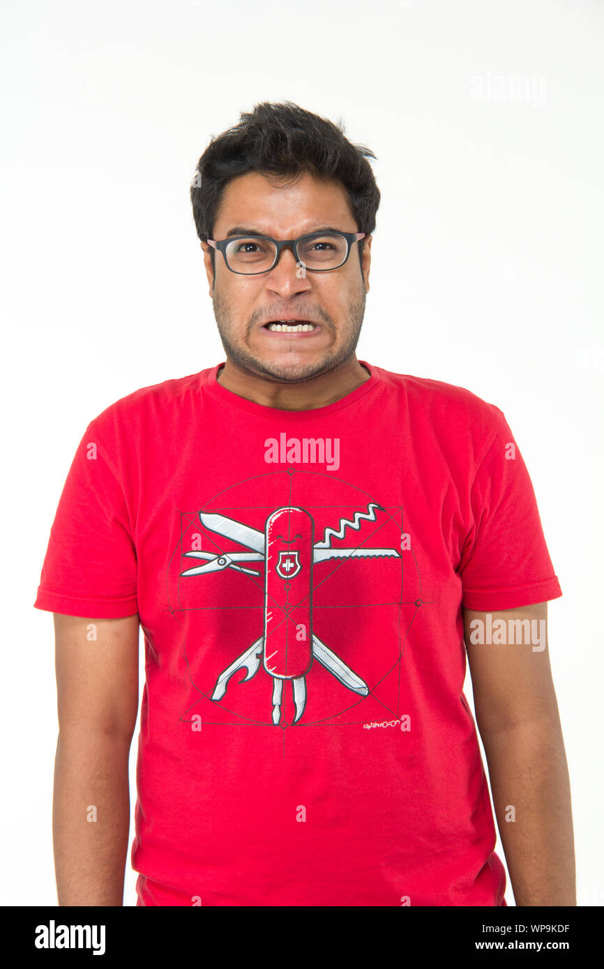 Young man looking angry Stock Photo - Alamy