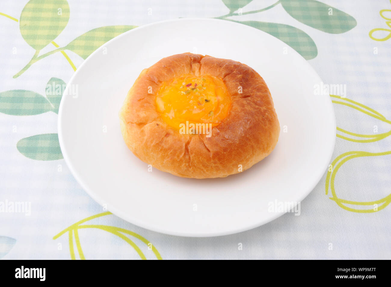 orange marmalade bread on plate isolated on table cloth Stock Photo - Alamy