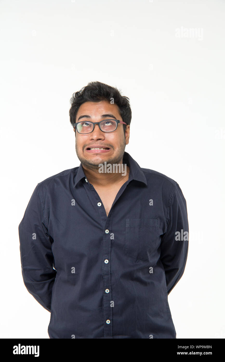 Young man looking irritated Stock Photo - Alamy