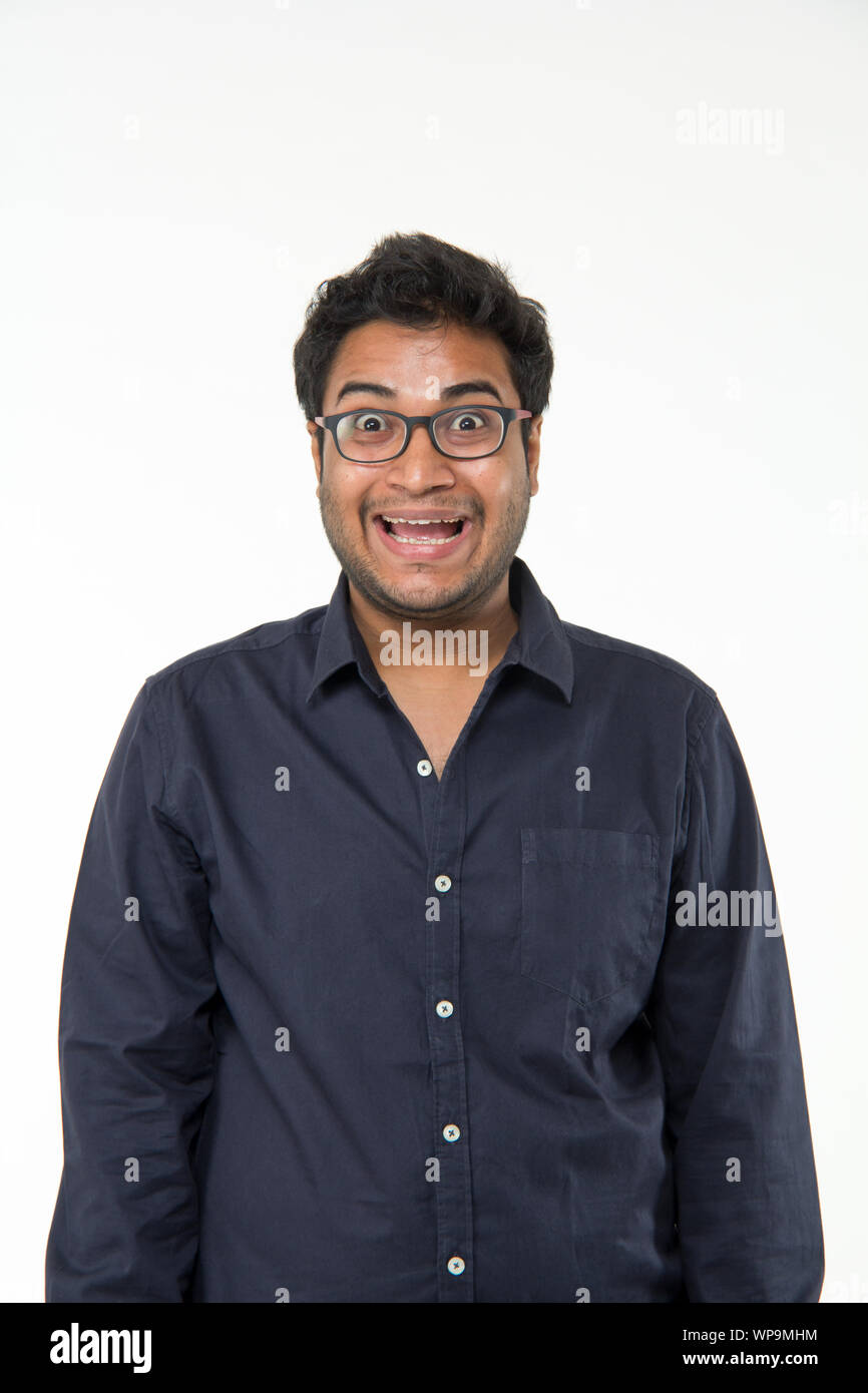 Young man looking surprised Stock Photo - Alamy