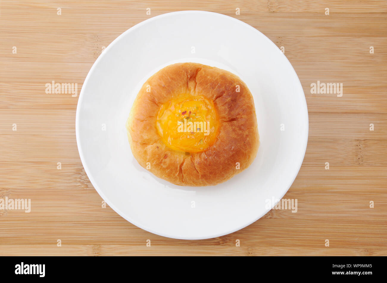 orange marmalade bread on plate isolated on table Stock Photo - Alamy