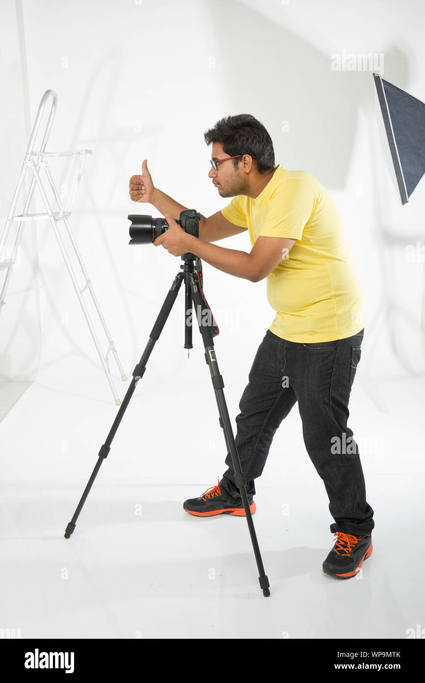 Photographer taking perfect shot Stock Photo - Alamy