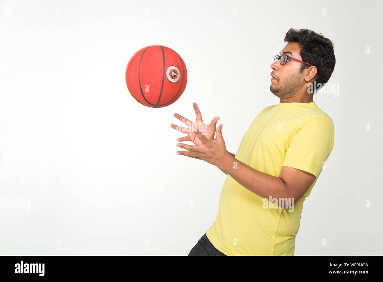 Basketball player catching ball hi-res stock photography and images - Alamy