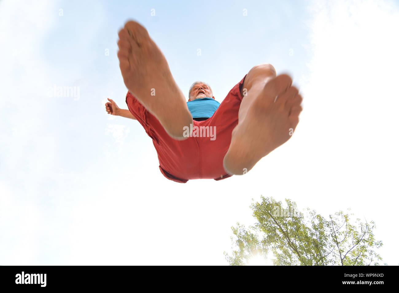 Carefree man jumping over hi-res stock photography and images - Alamy