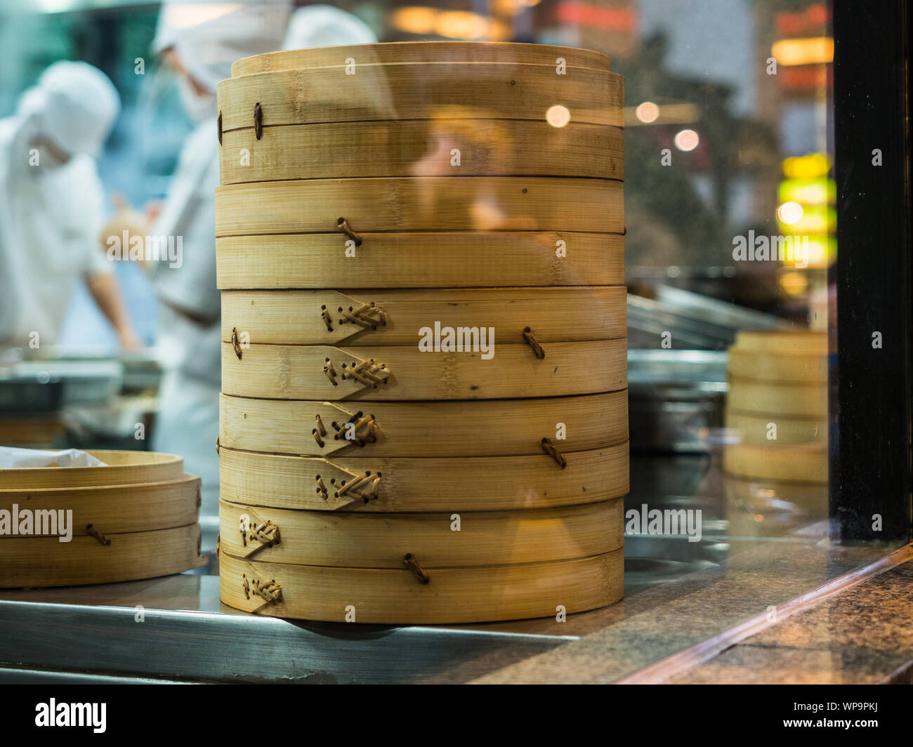 Dim sum steamers baskets at a Chinese restaurant Stock Photo - Alamy
