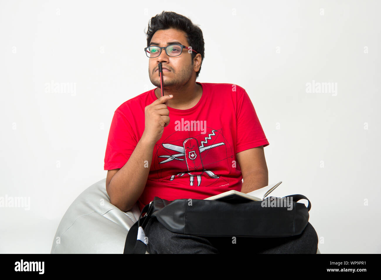 Indian college student thinking hi-res stock photography and images - Alamy
