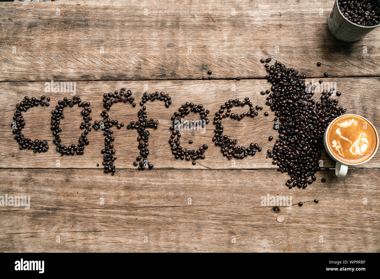 Coffee bean texture word with latte coffee on wood background Stock ...