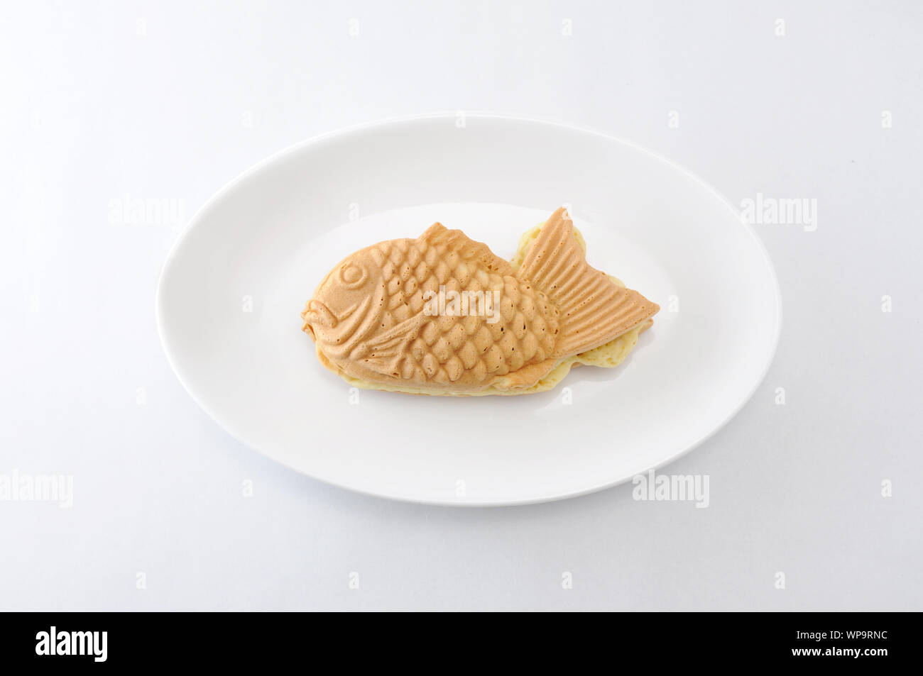 Japanese confectionery taiyaki fish cake wagashi on plate isolated on ...