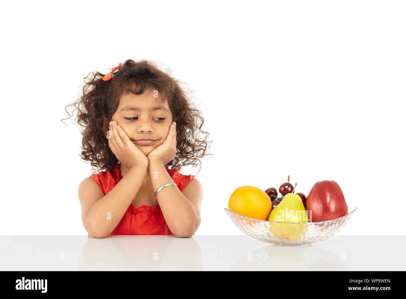 Girl refusing fruits Stock Photo - Alamy