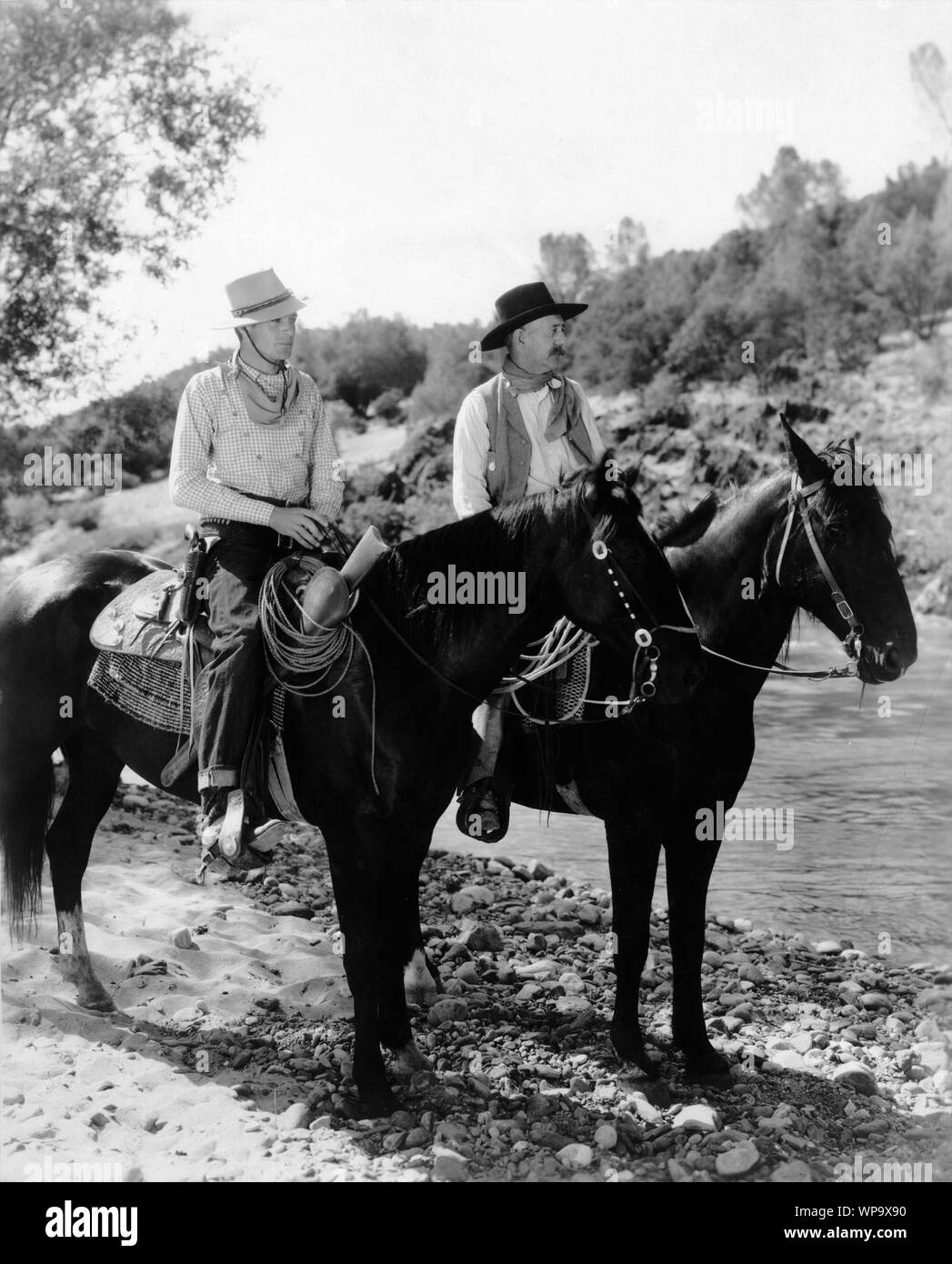 GARY COOPER and stuntman / cowboy BOB WARREN candid on location near ...