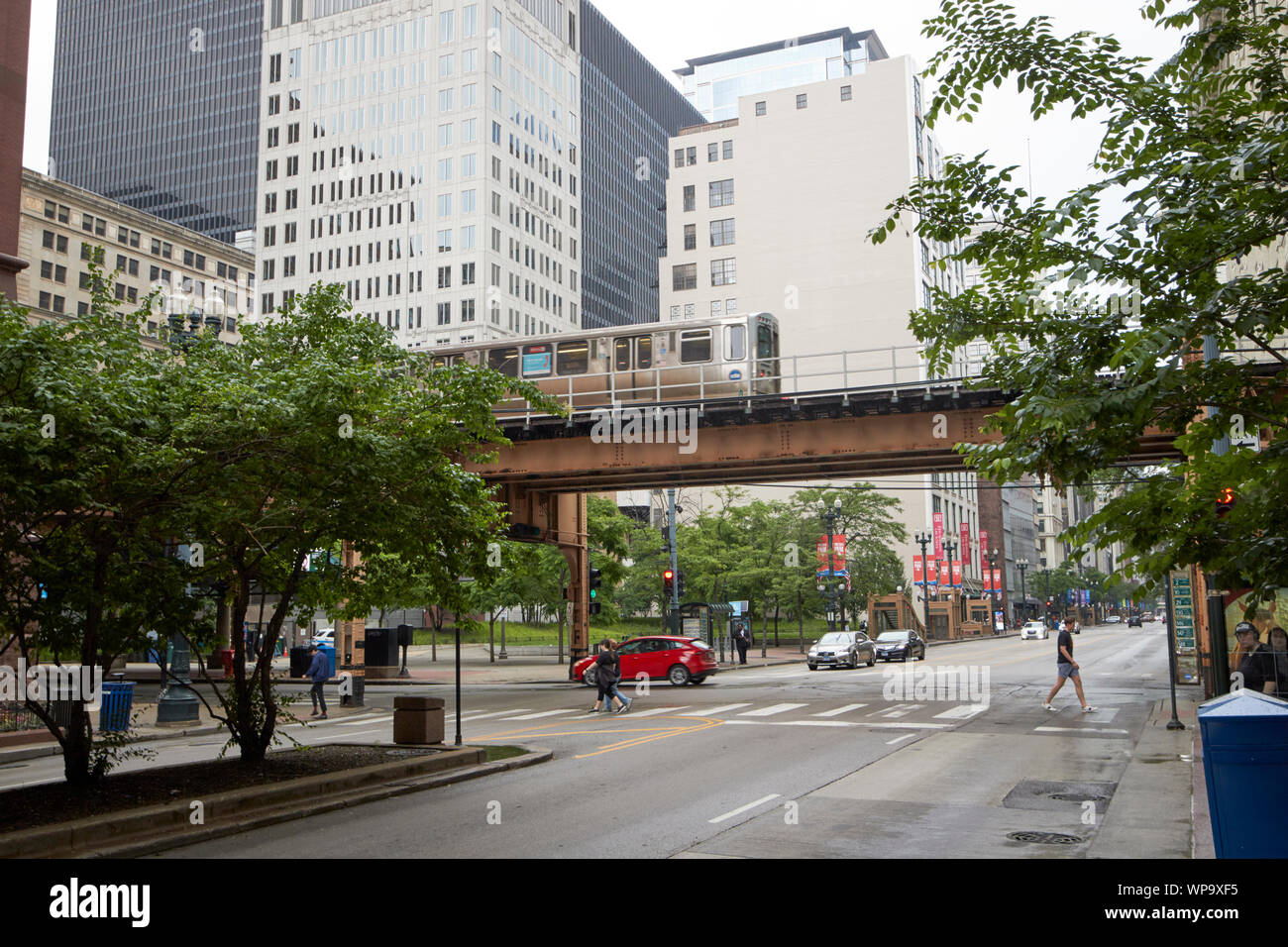 L train crossing state street at van buren on the loop on a rainy ...