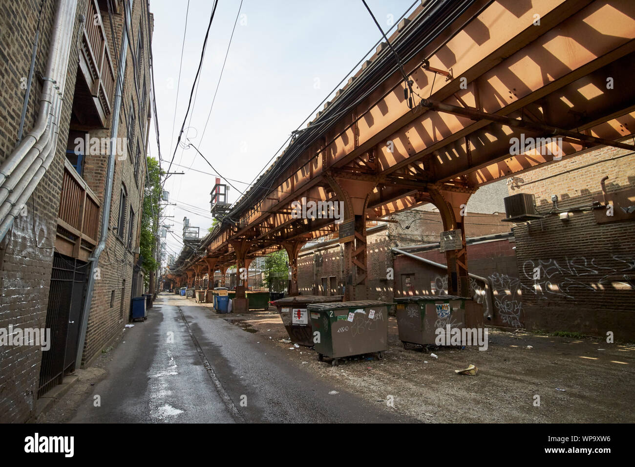 area under l train lines used for storage and garbage waste bins ...