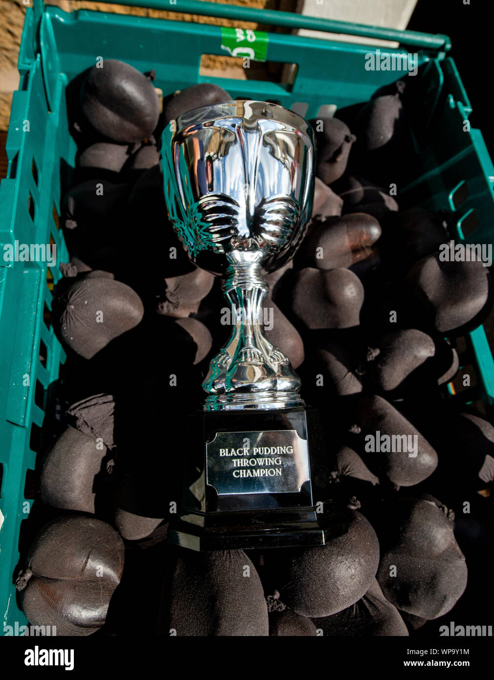 A tray of black puddings sits around the winning trophy during the ...