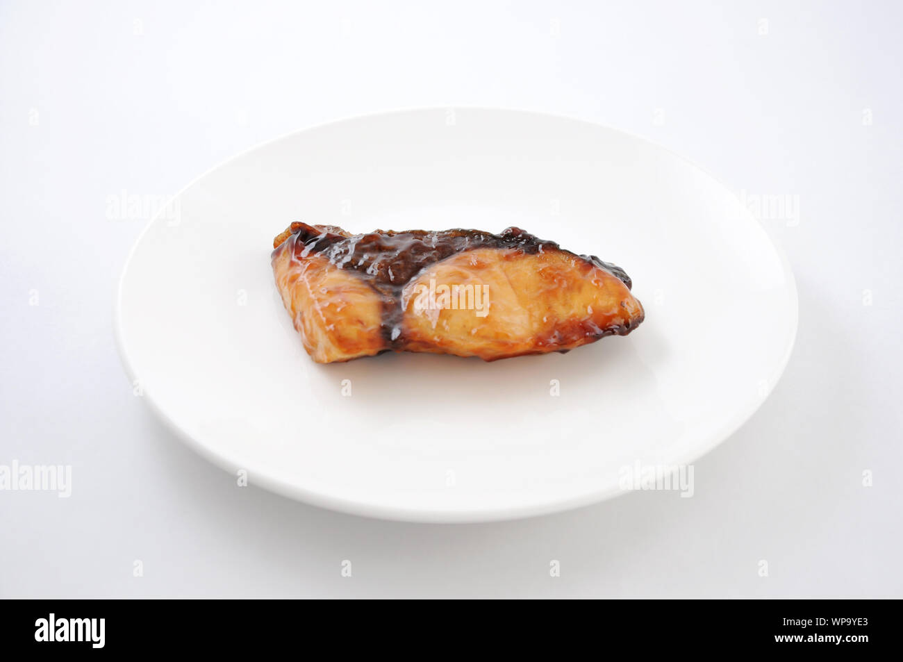 broiled teriyaki fish Japanese amberjack on plate isolated on white ...