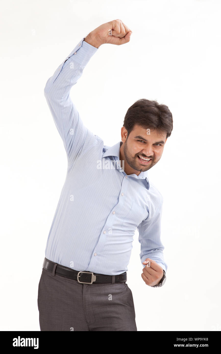 Young man celebrating his success Stock Photo - Alamy