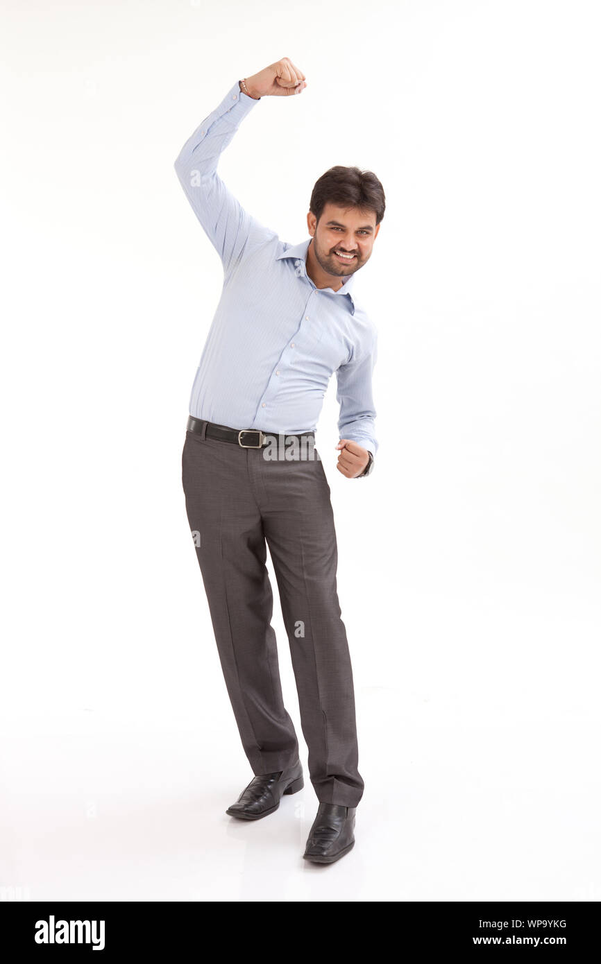 Young man celebrating his success Stock Photo - Alamy