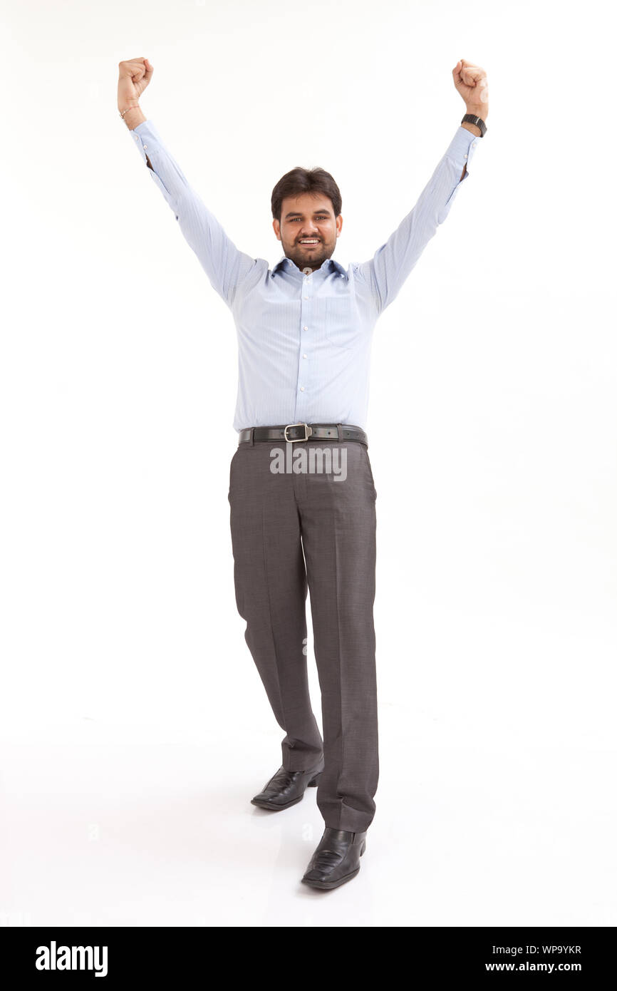 Young man celebrating his success Stock Photo - Alamy
