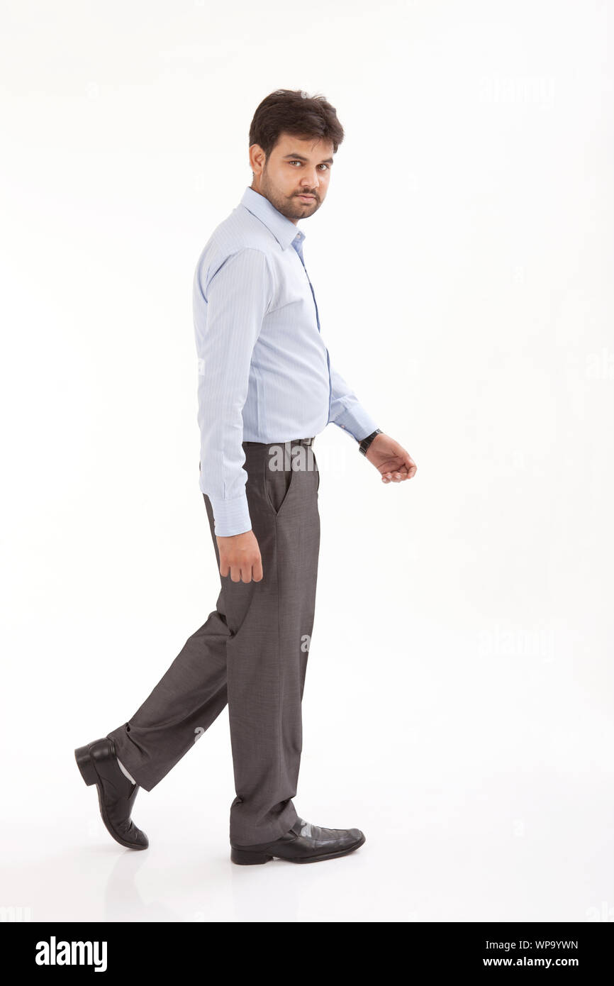 Indian man walking side view hi-res stock photography and images - Alamy
