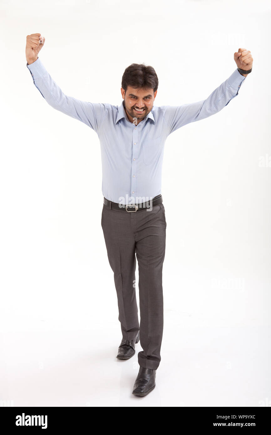 Young man celebrating his success Stock Photo - Alamy