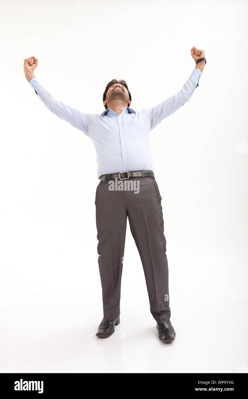 Young man celebrating his success Stock Photo - Alamy