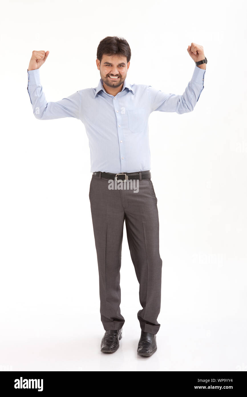Young man celebrating his success Stock Photo - Alamy