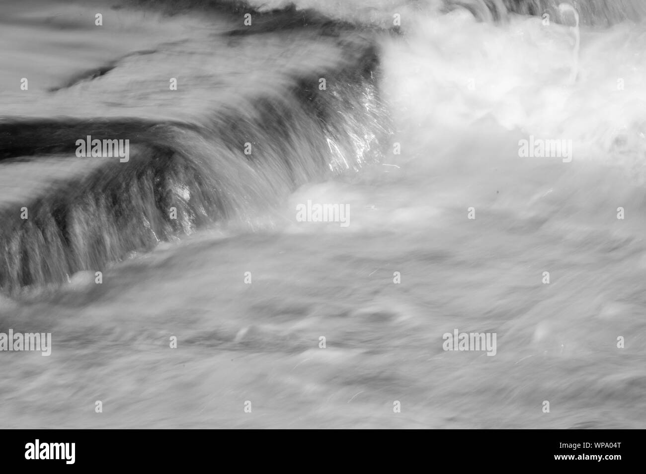 Black and White Abstract photographs of a seascape with strong backwash ...