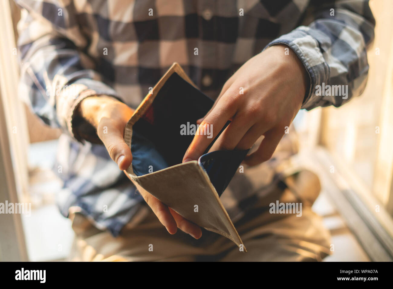 Poor person purse hi-res stock photography and images - Alamy