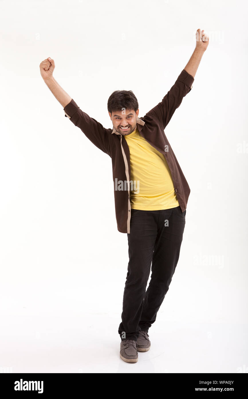 Young man celebrating his success Stock Photo - Alamy
