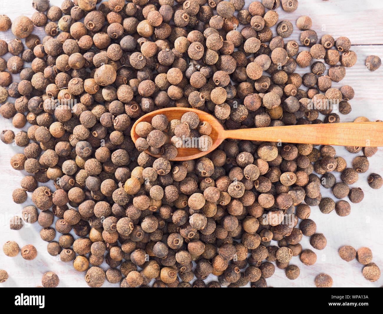 Allspice (Jamaica pepper) in a wooden spoon horizontally Stock Photo ...